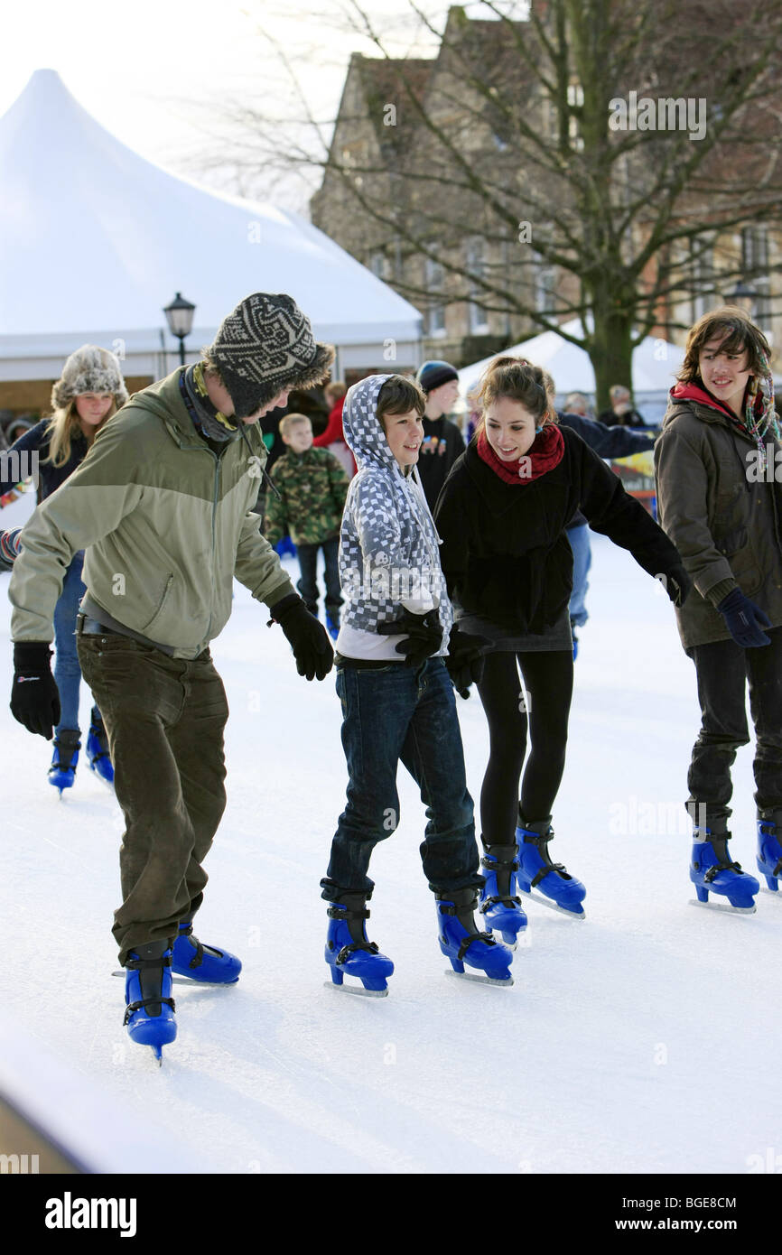 Teenage boys ice skating at an outdoor rink Stock Photo - Alamy