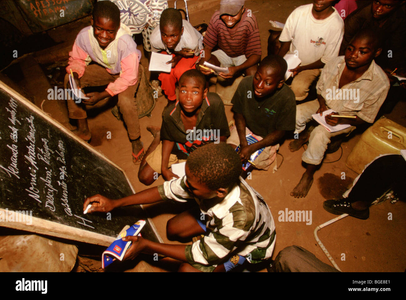 Homeless street children who live in dumped cars attend a mobile night ...