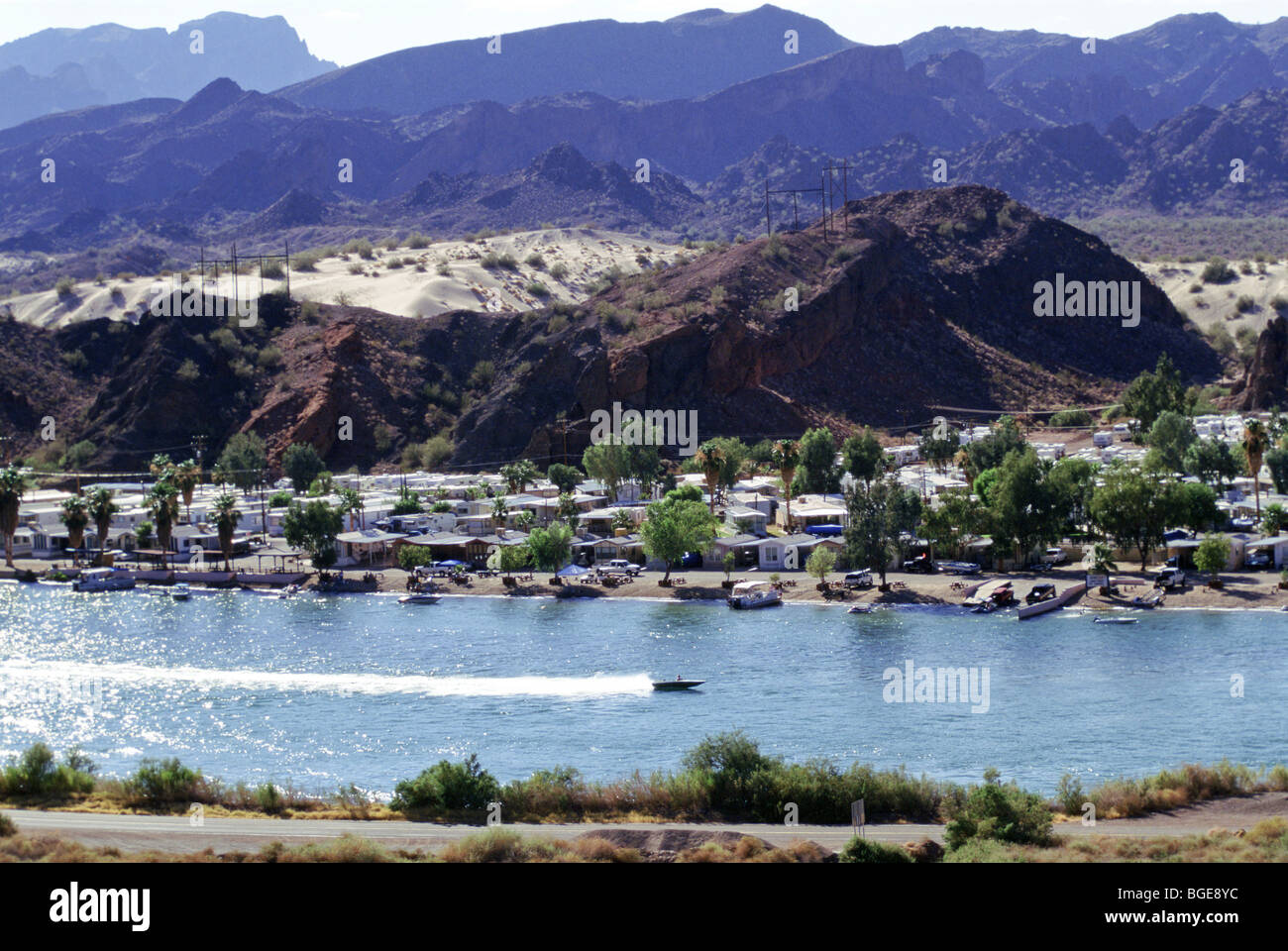 A pleasure boat speeds along the Colorado river near Lake Havasu, USA ...