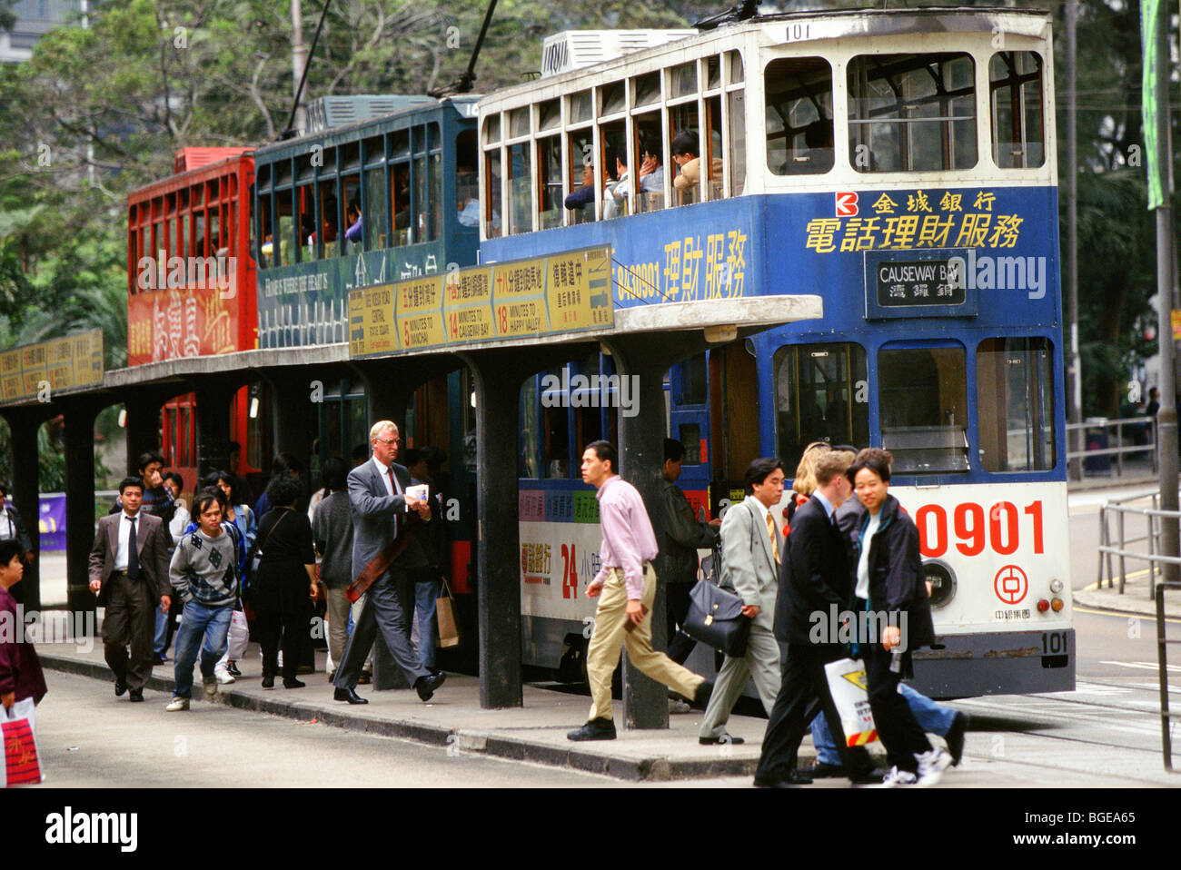 Trams run through Hong Kong's busy streets, 1996 Stock Photo - Alamy