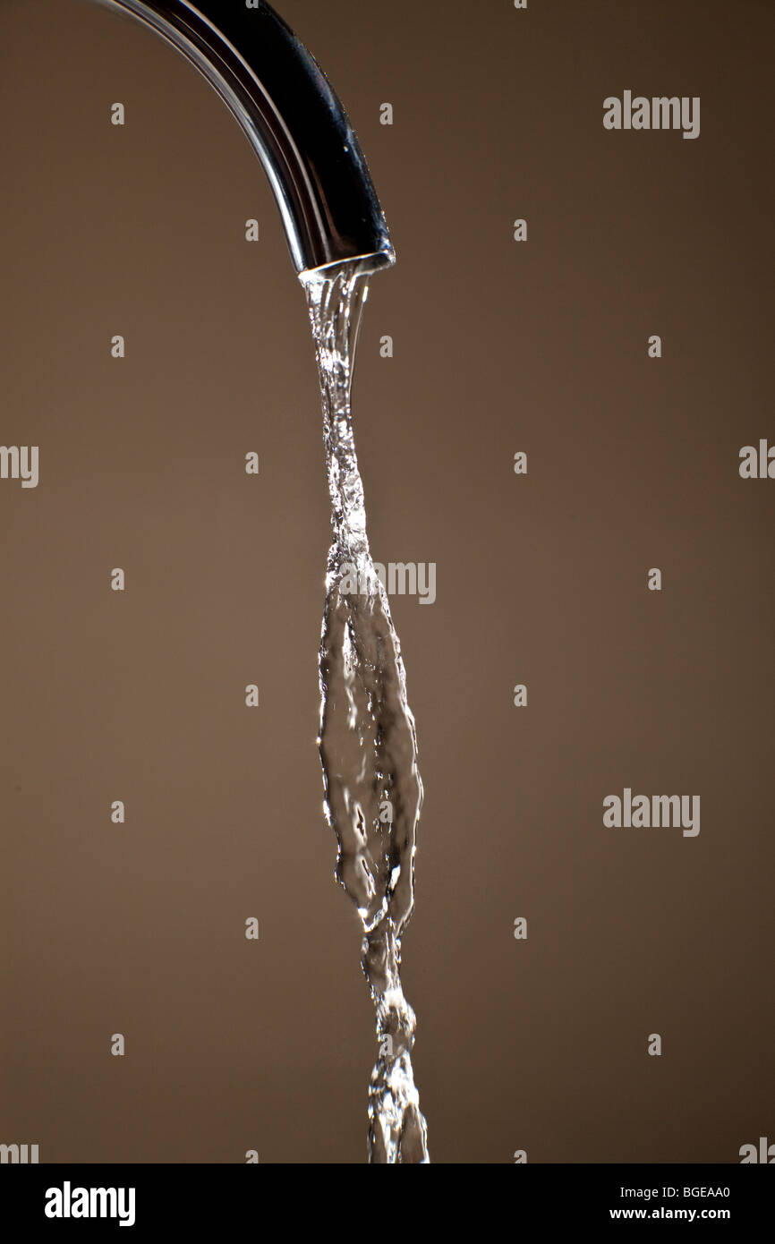 Water running from a domestic tap Stock Photo - Alamy
