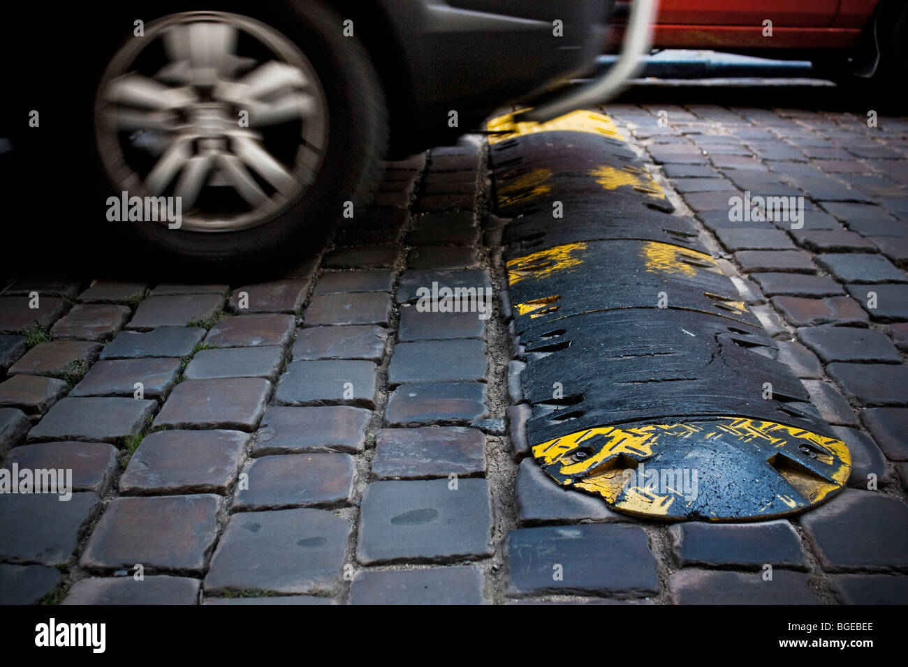 A car about to drive over a speed bump Stock Photo - Alamy