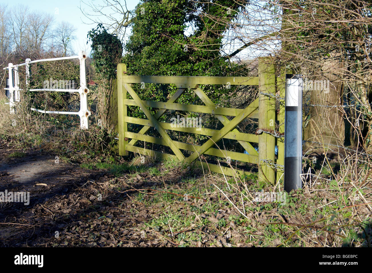 Chained wooden five bar gate by a bridge over the River Itchen at Five ...