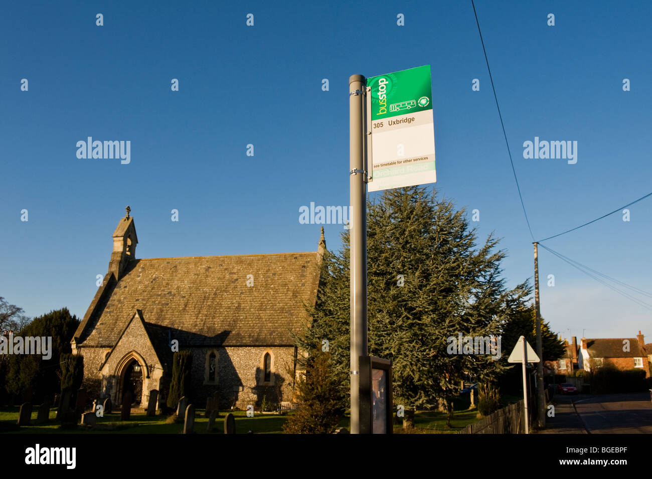 A public transport bus stop sign outside a church in Seer Green, a ...