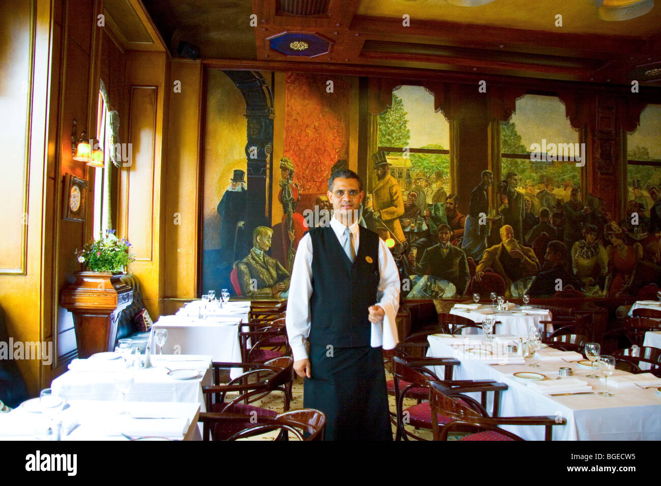A waiter poses in the center of the dining room at The Grand Cafe one ...