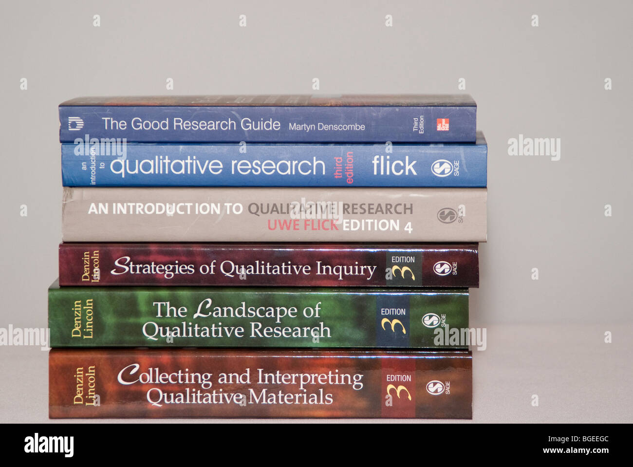 University textbooks on a light coloured plain background Stock Photo ...