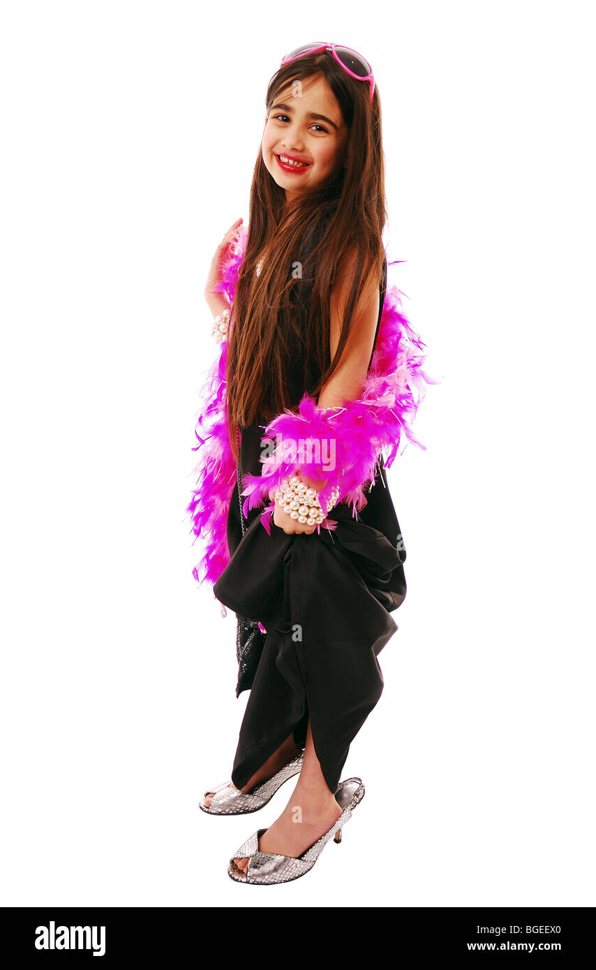 Young girl dressing up in grown up clothes Stock Photo - Alamy