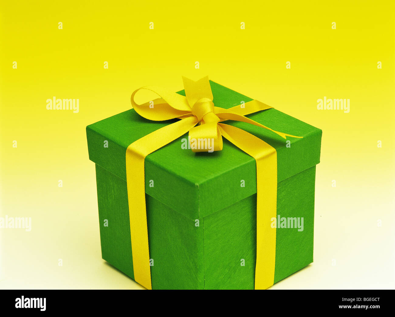 Gift box with yellow ribbon Stock Photo - Alamy