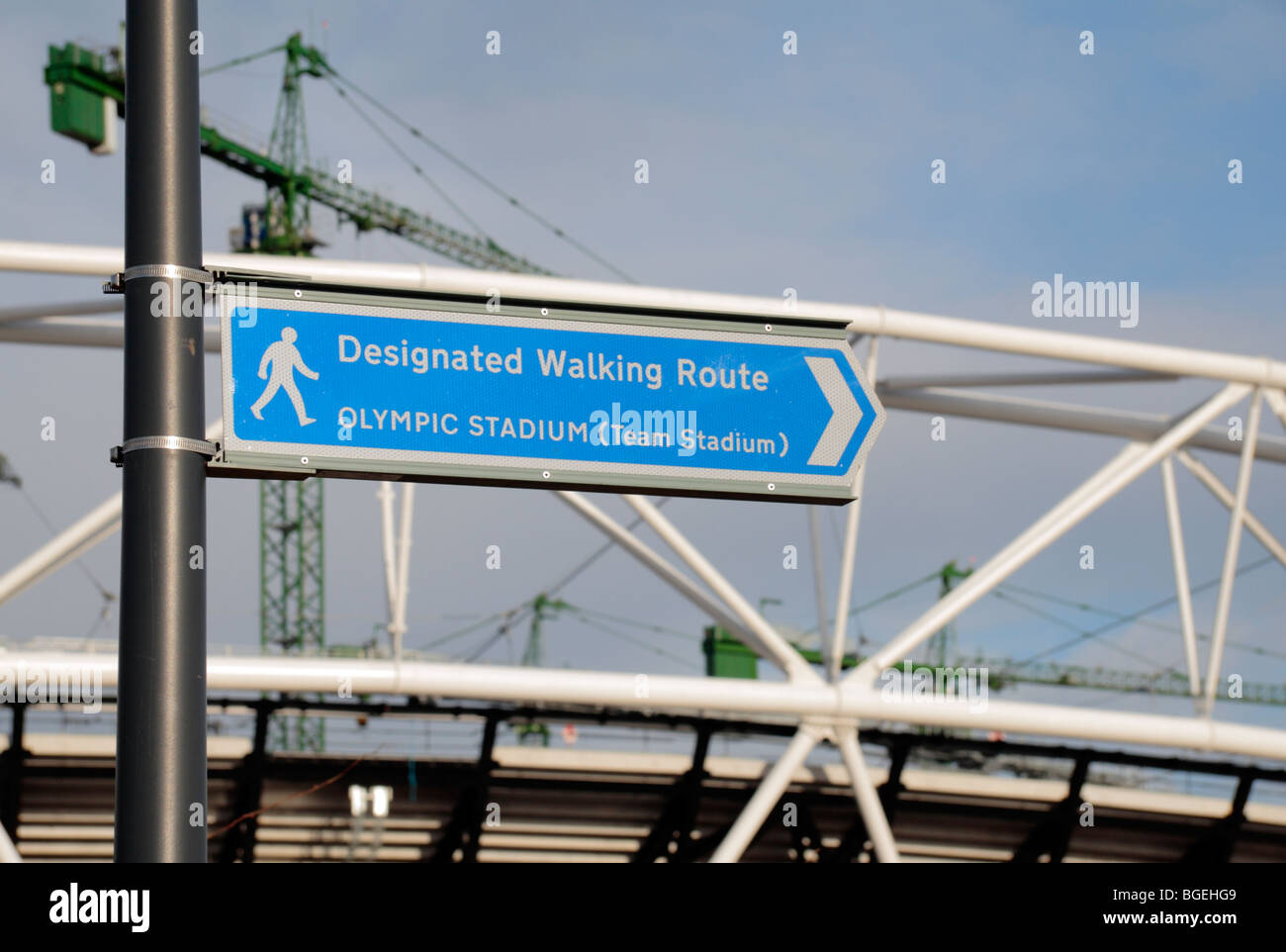 Pedestrian sign in front of th partly constructed London 2012 Olympic ...
