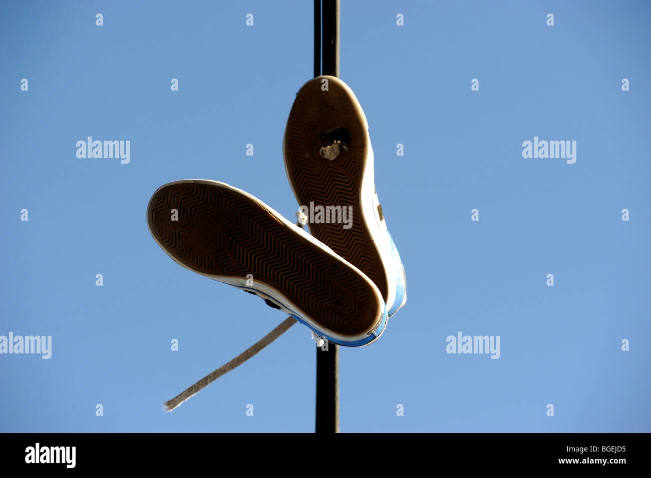 Trainers hanging from street cable hi-res stock photography and images ...