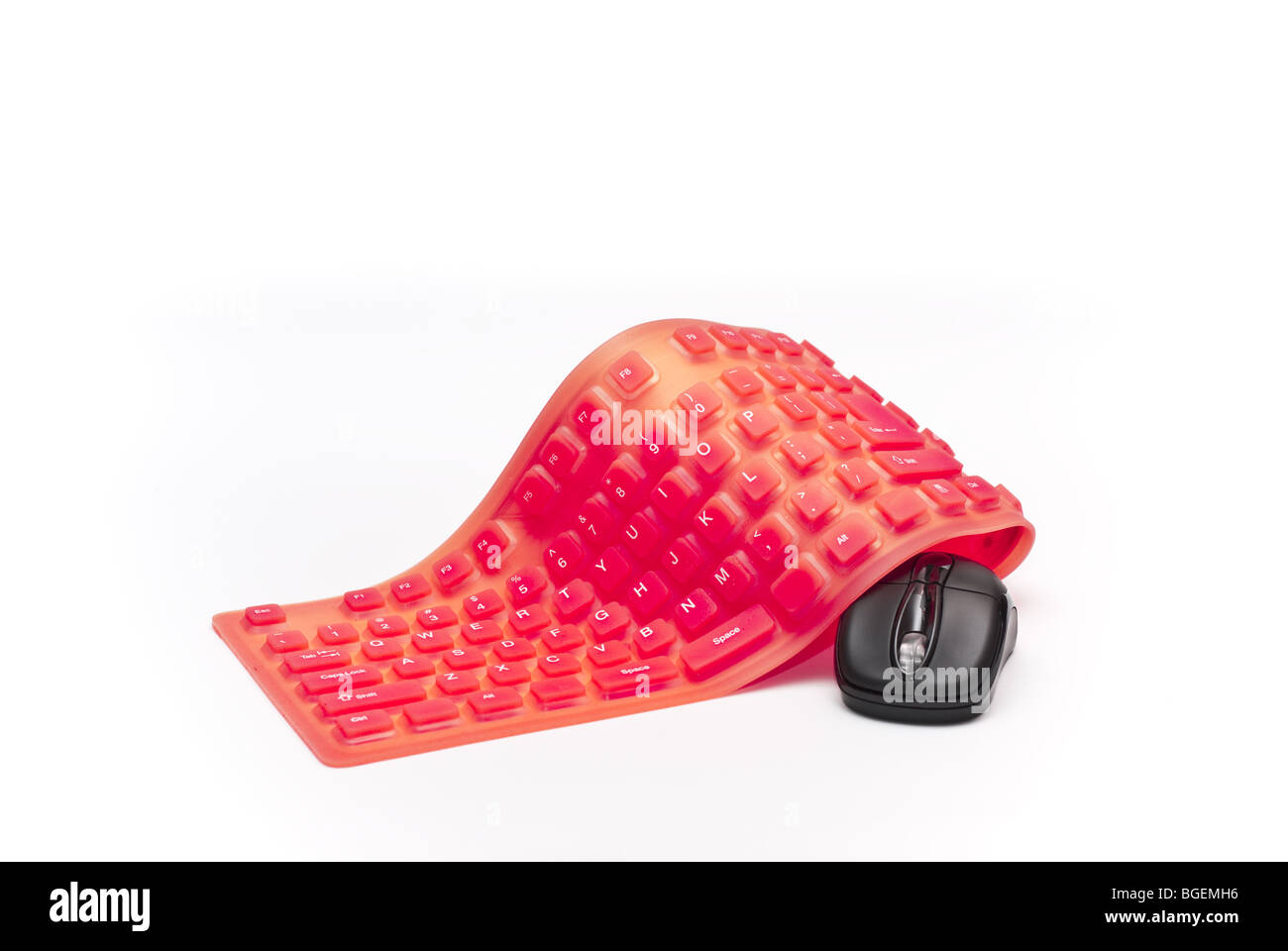 magenta flexible computer keyboard with black mouse Stock Photo - Alamy