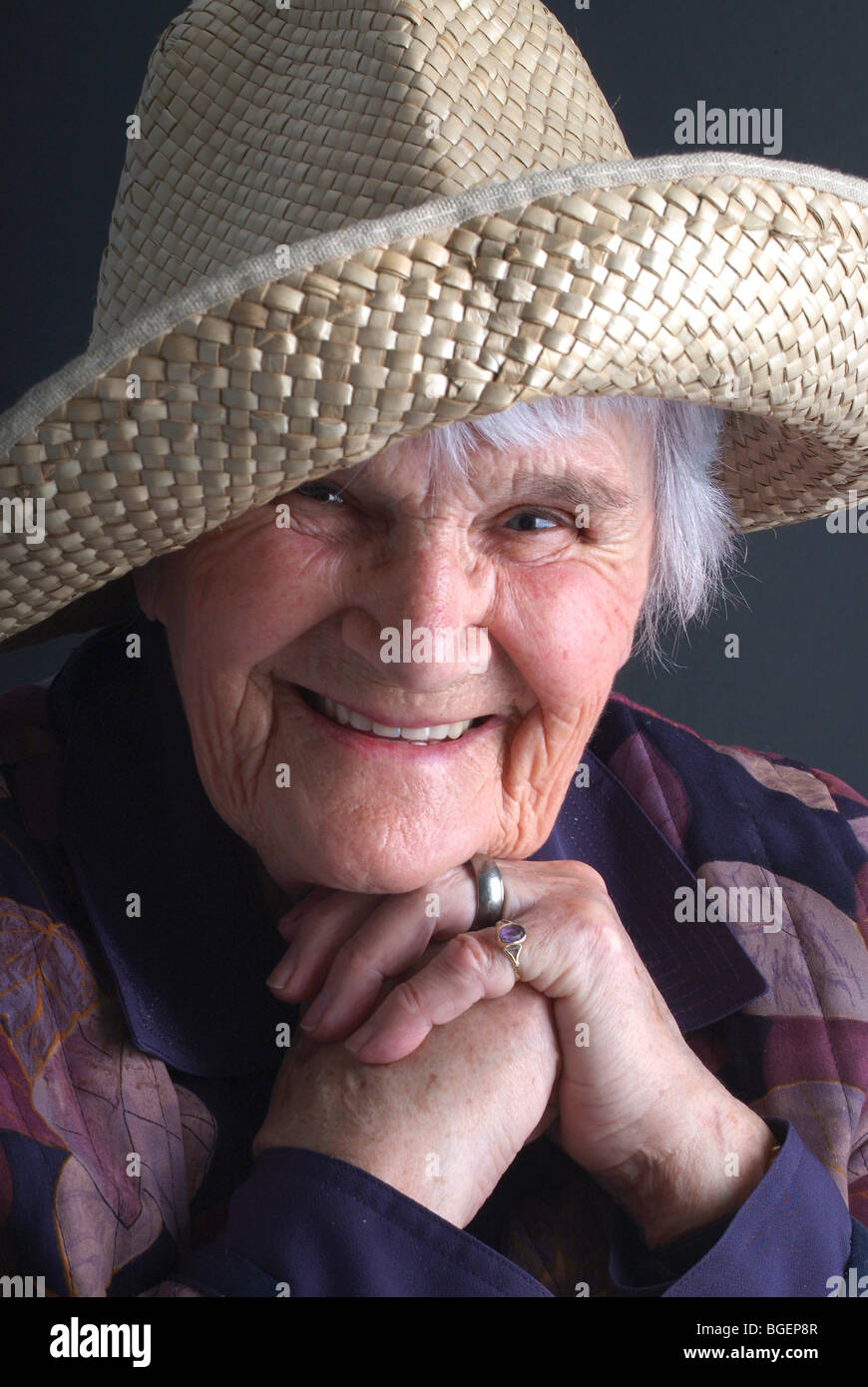 A happy old lady in a straw hat Stock Photo - Alamy
