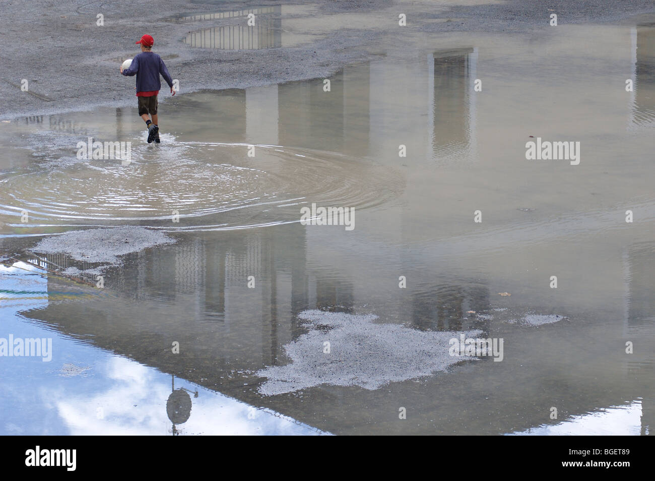 Rain kids football hi-res stock photography and images - Alamy