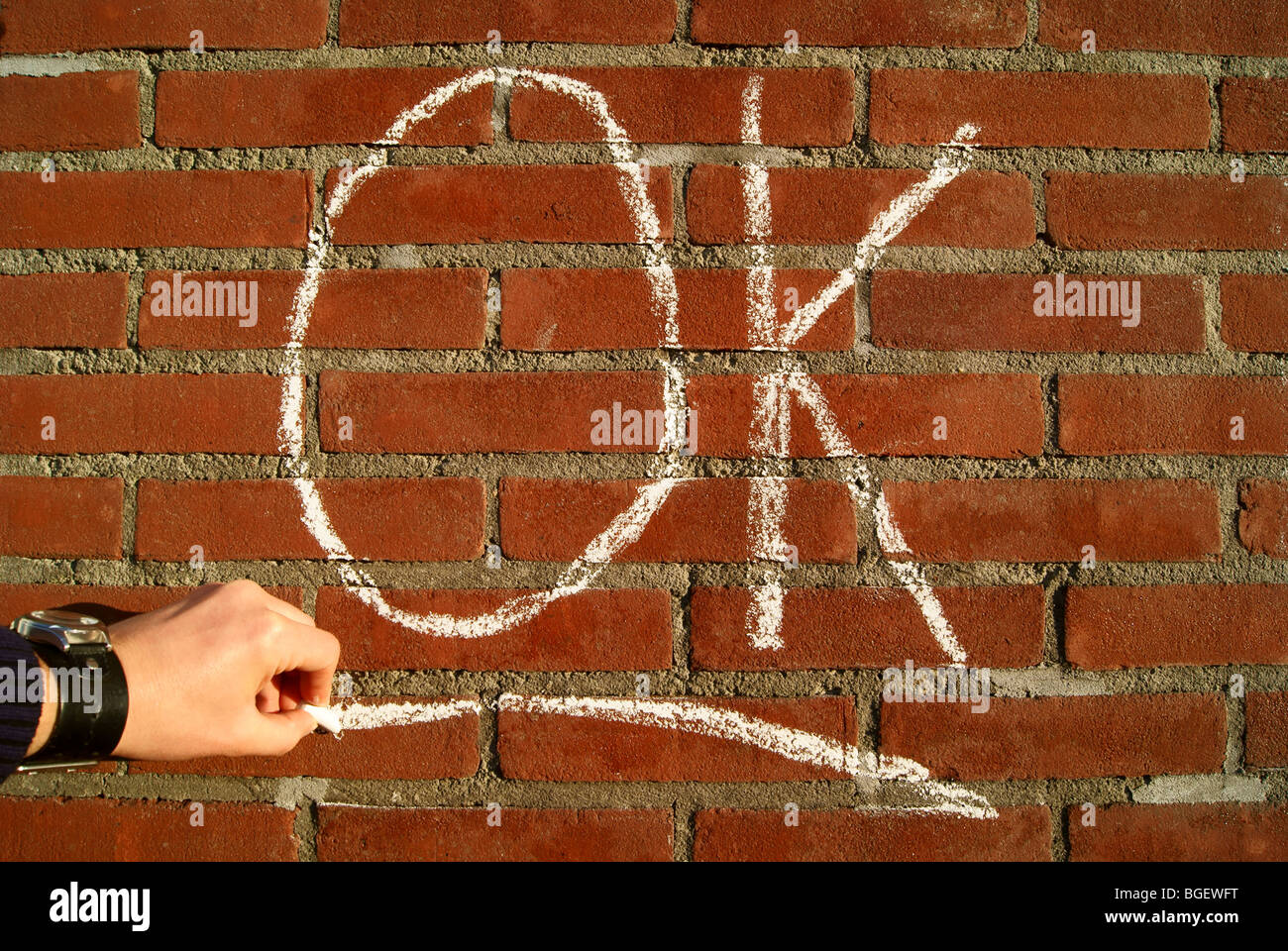 The word OK written on a red brick wall Stock Photo - Alamy