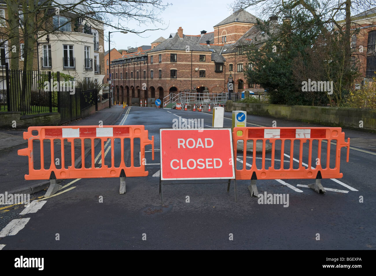 A road is blocked using barriers and a road closed sign Stock Photo - Alamy