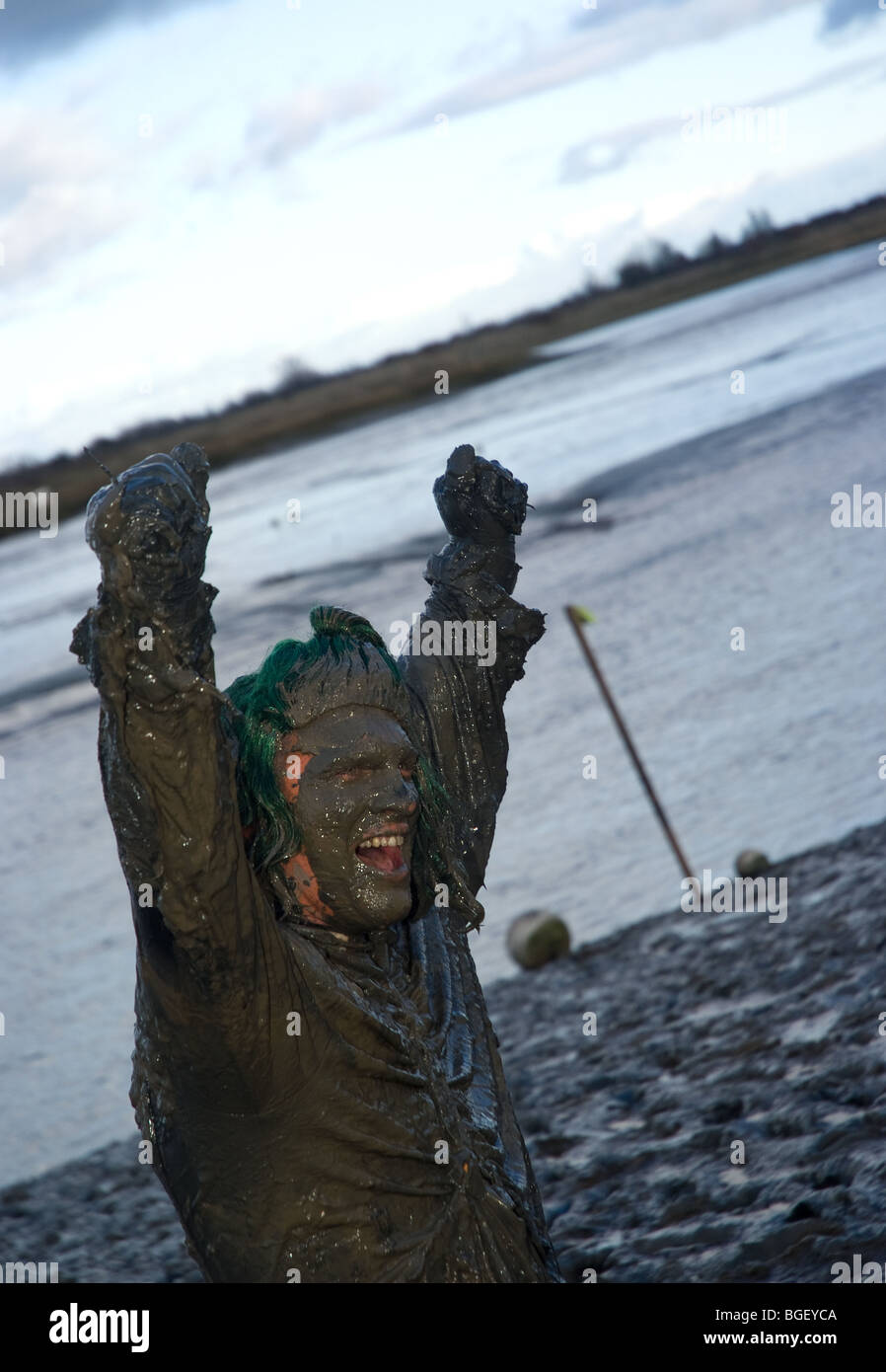 a competitor punches the air after crossing the finish line at the ...