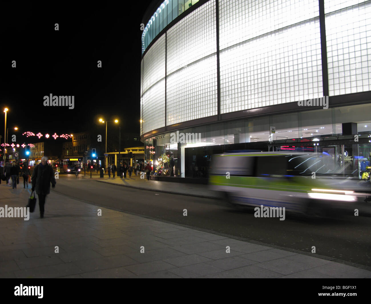 Next Department store High St Exeter Devon UK police van at speed Stock ...