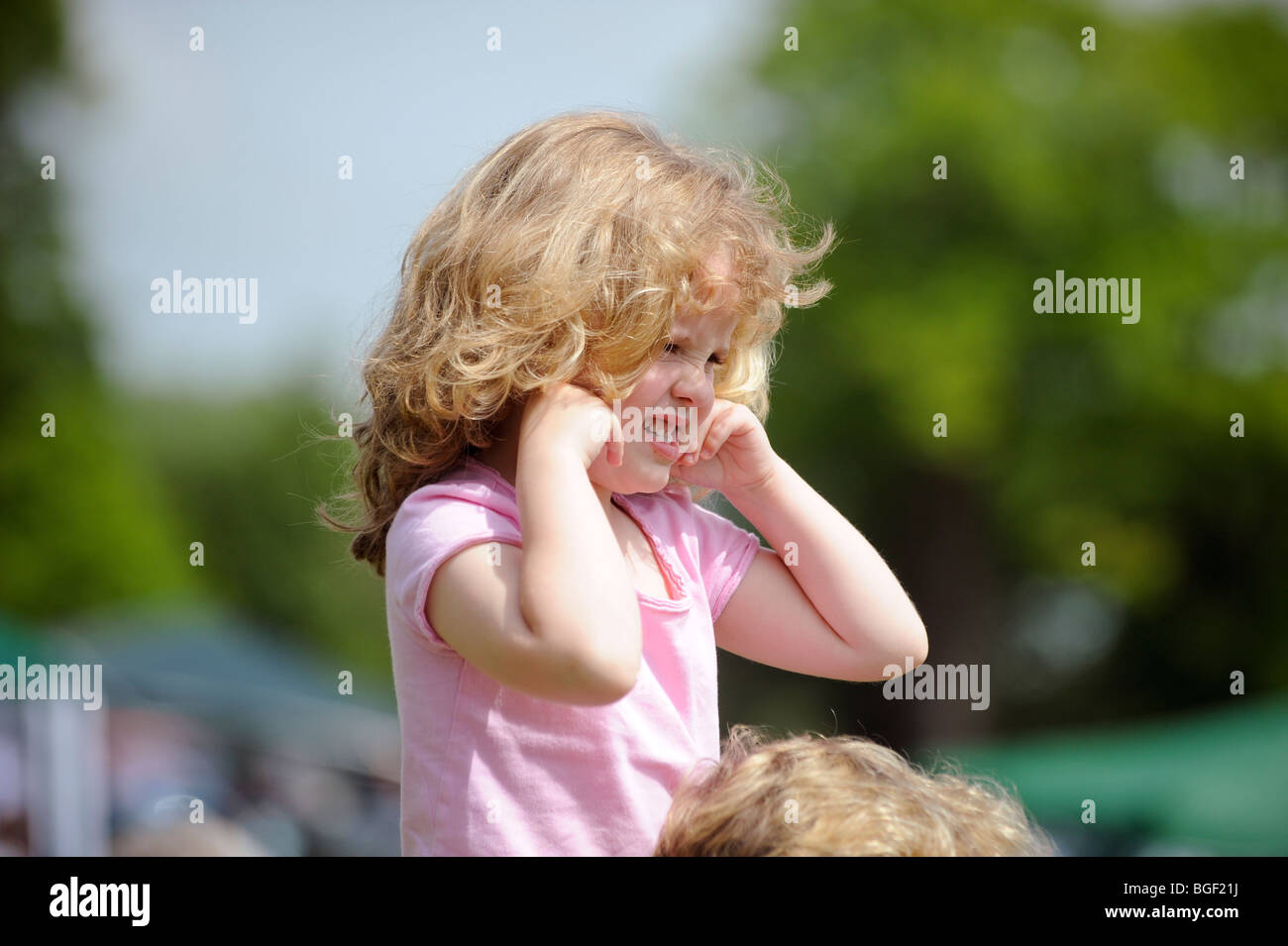 Loud and 'fingers in ears' and music hi-res stock photography and ...