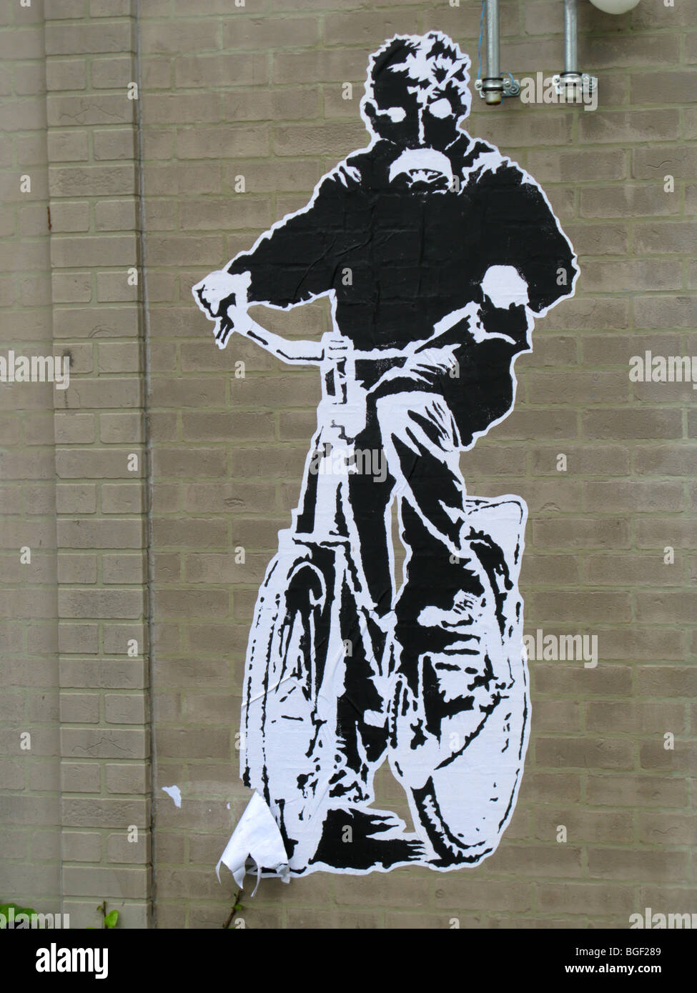 Environmentalist graffiti poster cyclist wearing gas mask against air ...