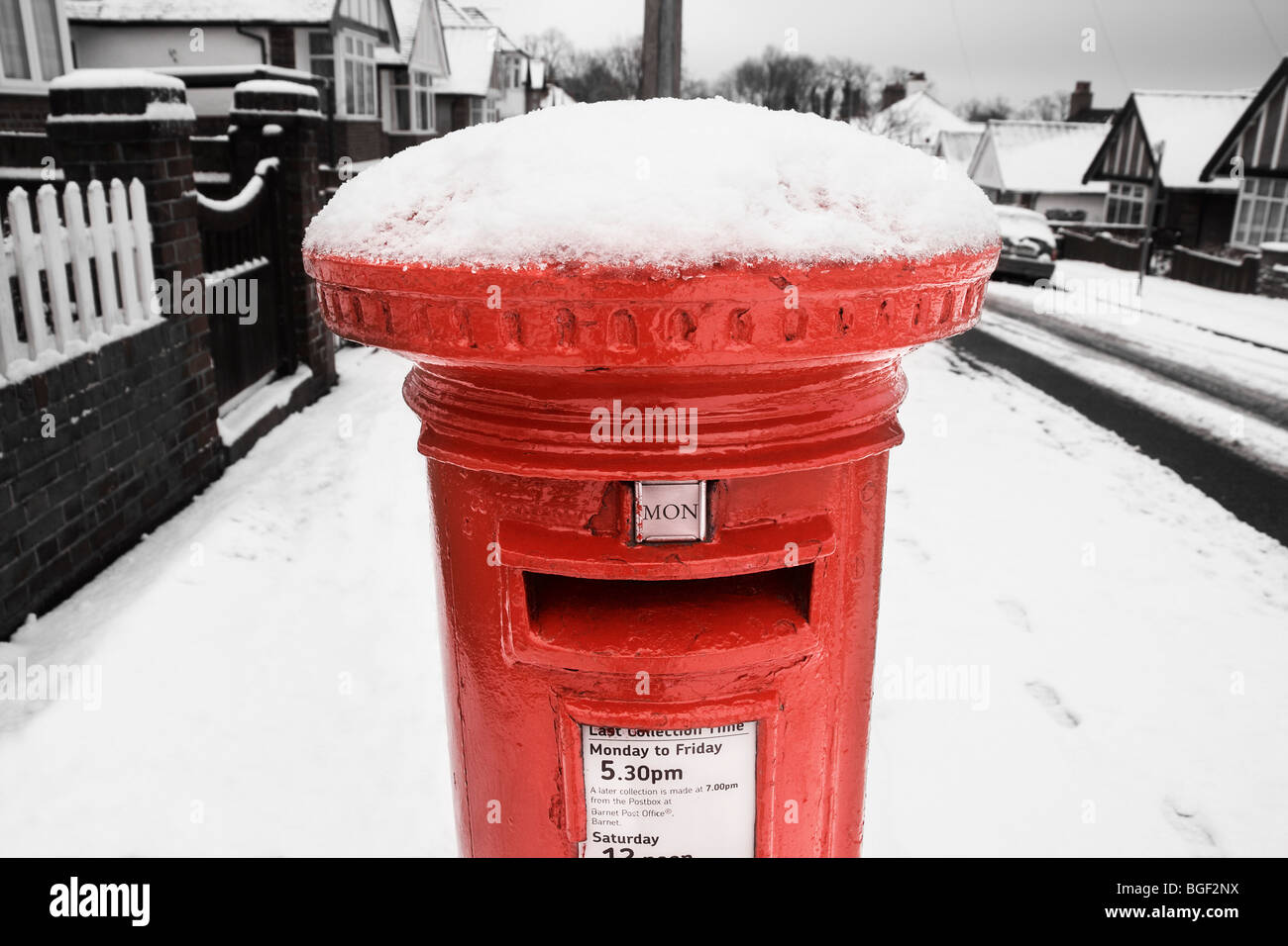 snow covered British pillar box Stock Photo - Alamy