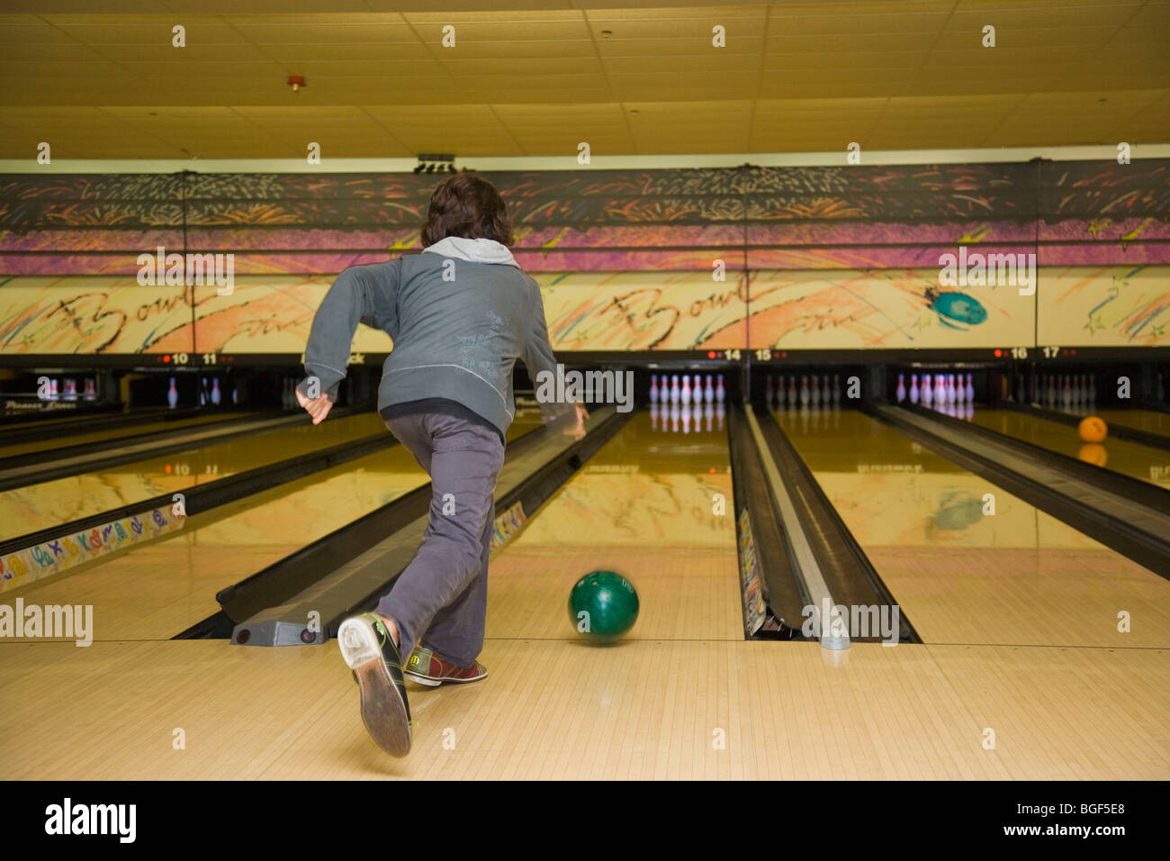 Teenage boy bowling Stock Photo - Alamy