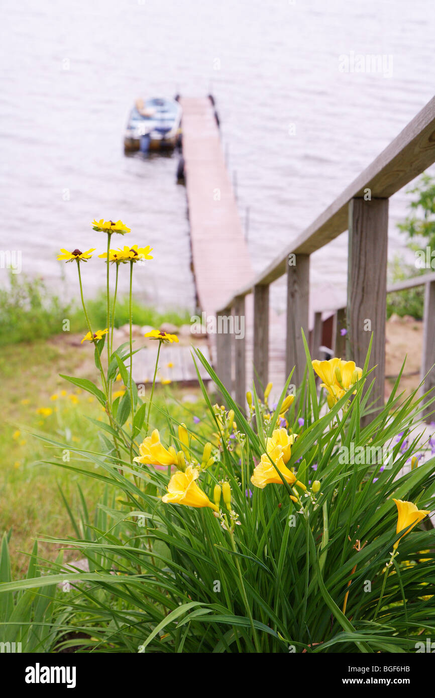Wooden ramp leading to fishing boat and boat dock on fishing lake ...