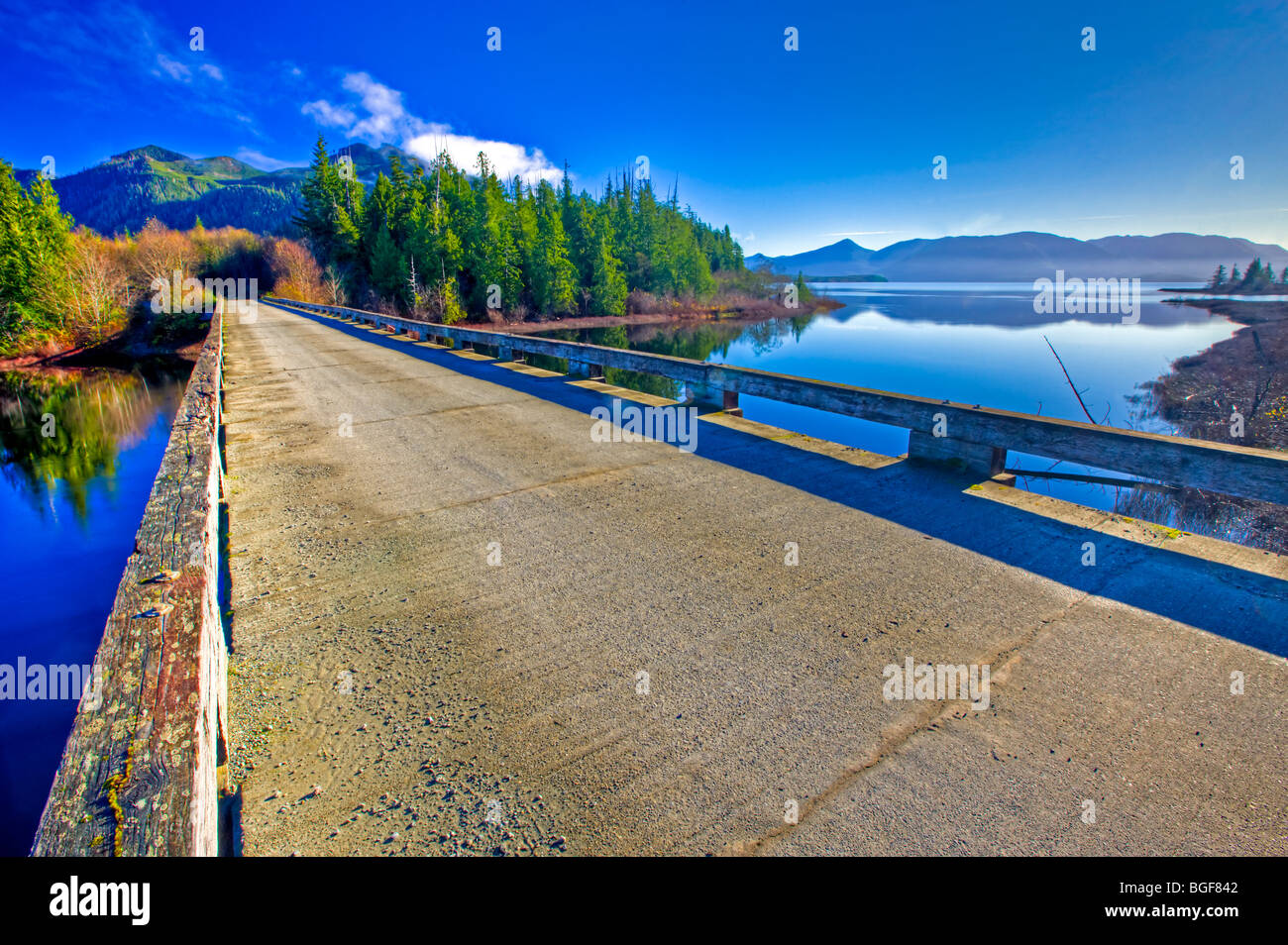 Bridge spanning the Kennedy River with a view towards Kennedy Lake, a ...