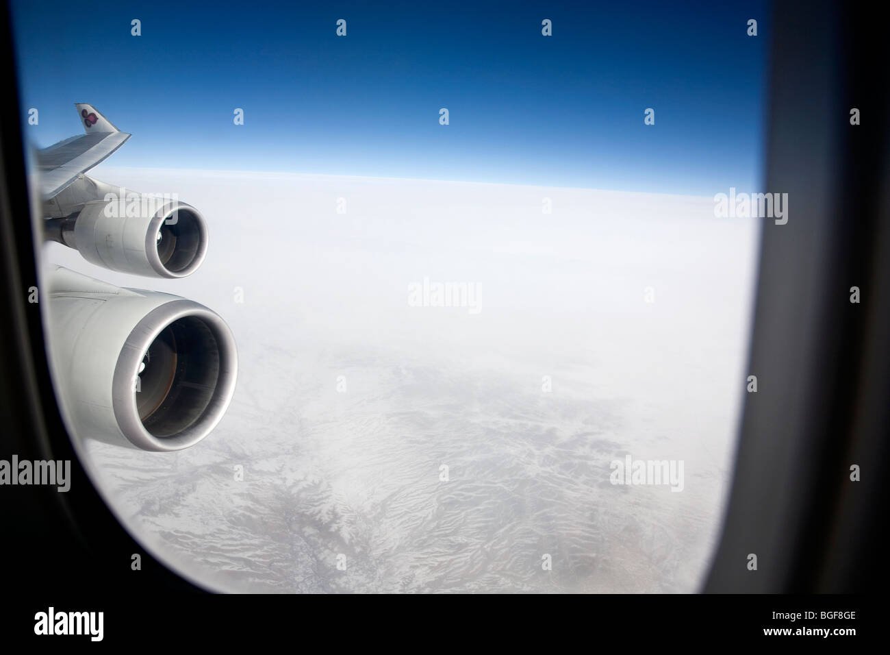 Thai Airplane flying over snowy terrain (Afghanistan Stock Photo - Alamy