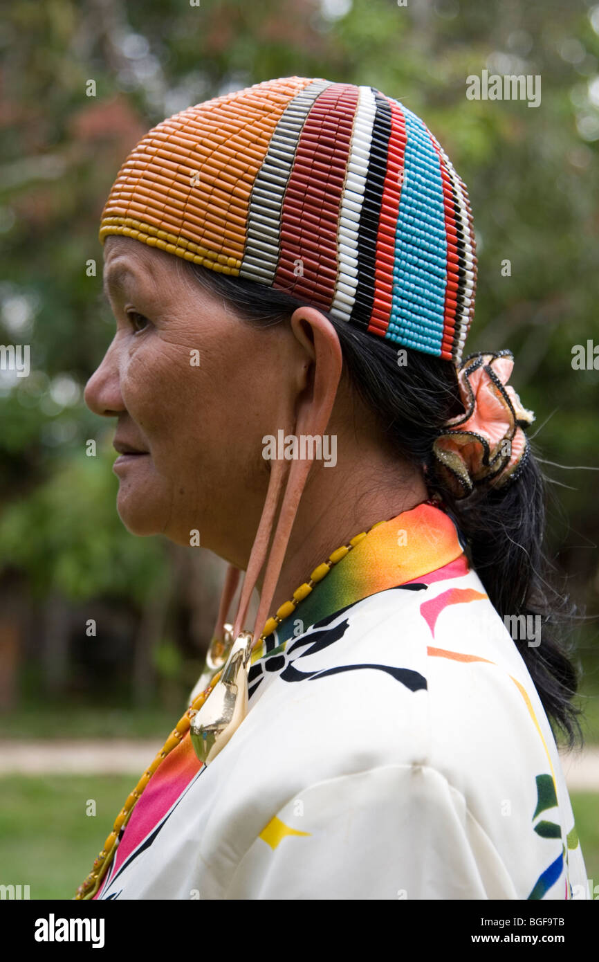 Kelabit women with the traditional colourful cap and elongated earlobes ...