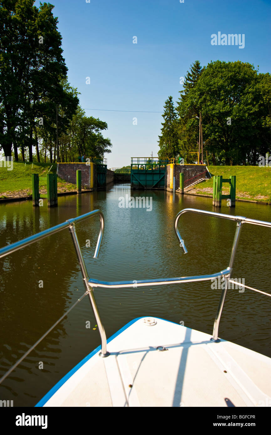 Bow of yacht entering lock near Lubstowo on Nogat River, Pomerania ...