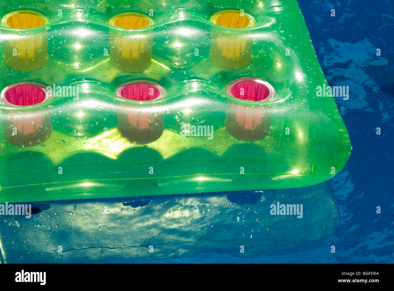 Section of inflatable sun bed floating in swimming [pool Stock Photo ...