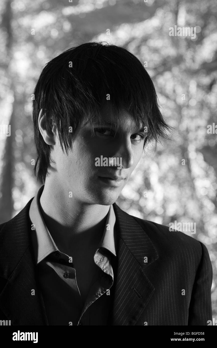 Studio shot of an handsome and expressive man on isolated silver ...