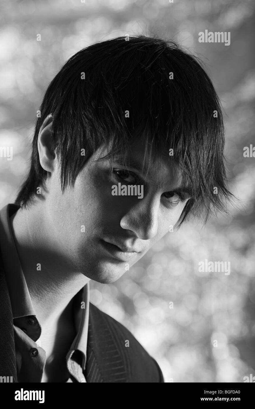 Studio shot of an handsome and expressive man on isolated silver ...