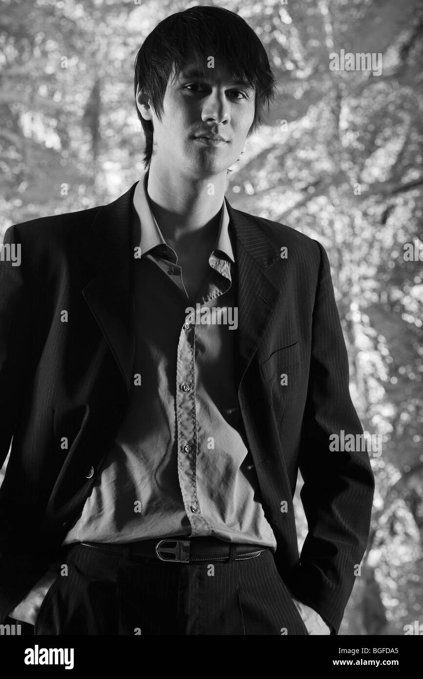 Studio shot of an handsome and expressive man on isolated silver ...