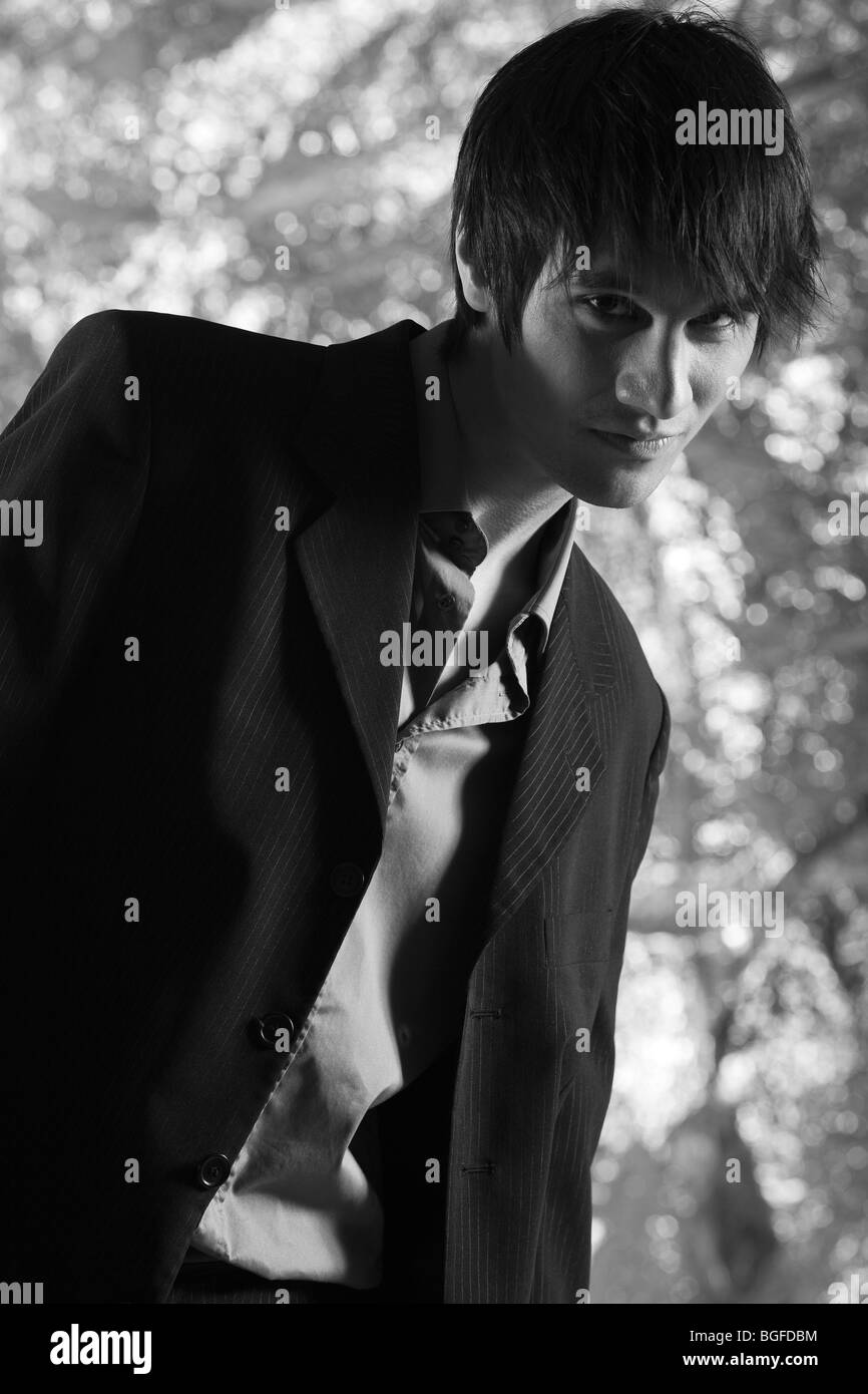 Studio shot of an handsome and expressive man on isolated silver ...