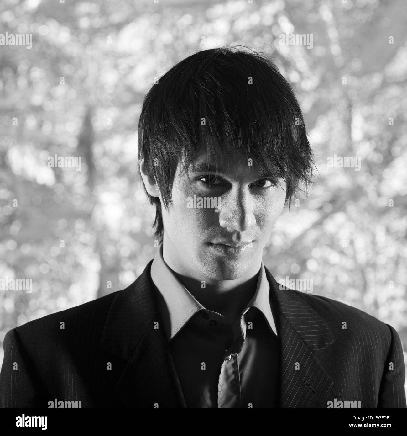 Studio shot of an handsome and expressive man on isolated silver ...