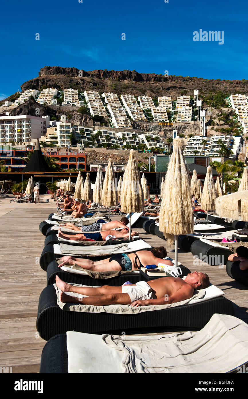 Soaking sun on beach hi-res stock photography and images - Alamy