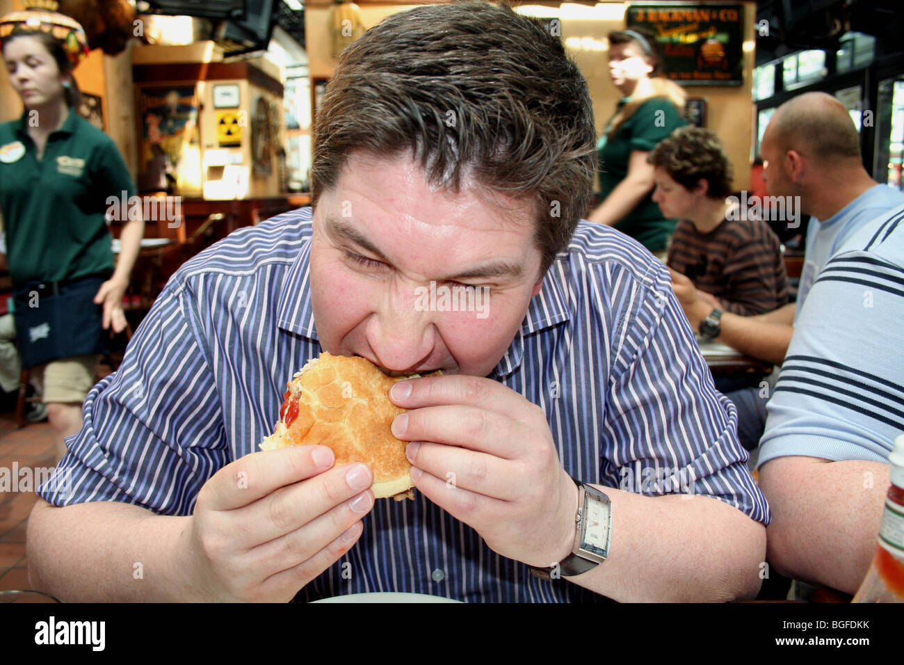 Man eating a burger in Cheers bar Boston USA Stock Photo - Alamy