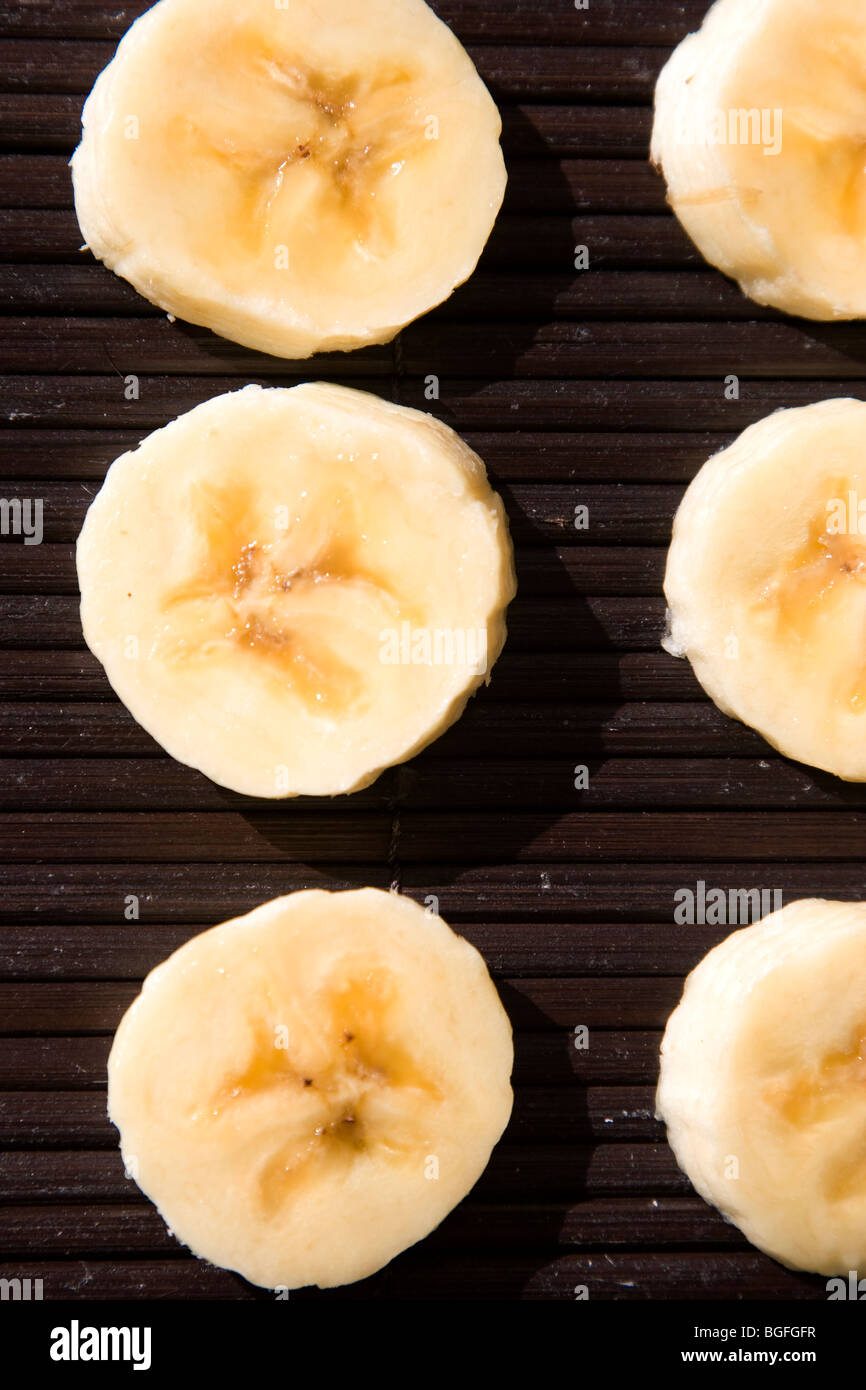 Bananas on mat Stock Photo - Alamy