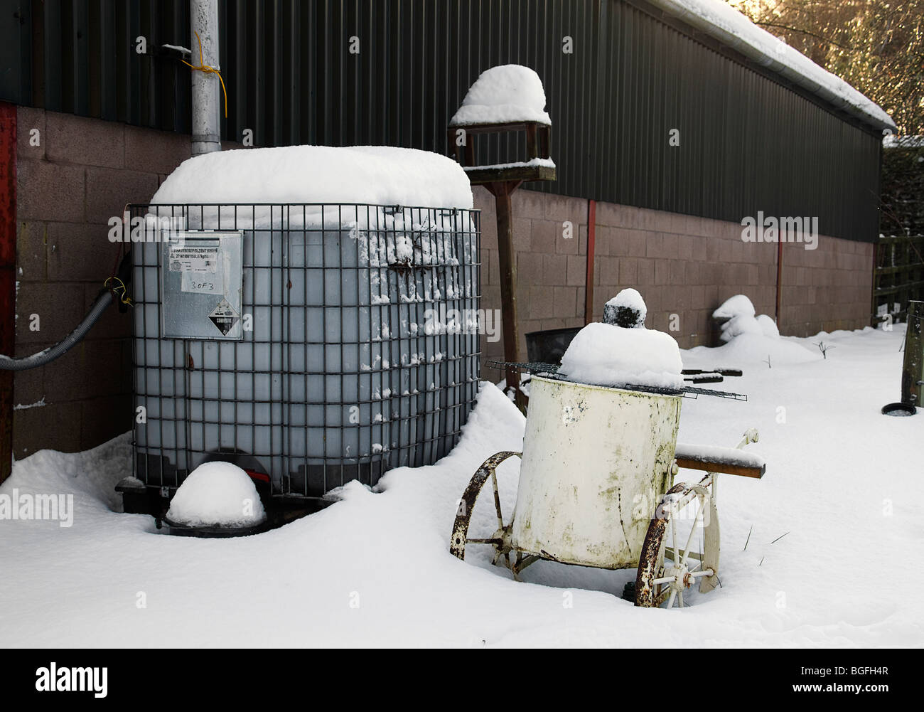 Snow covered water carriers Stock Photo - Alamy