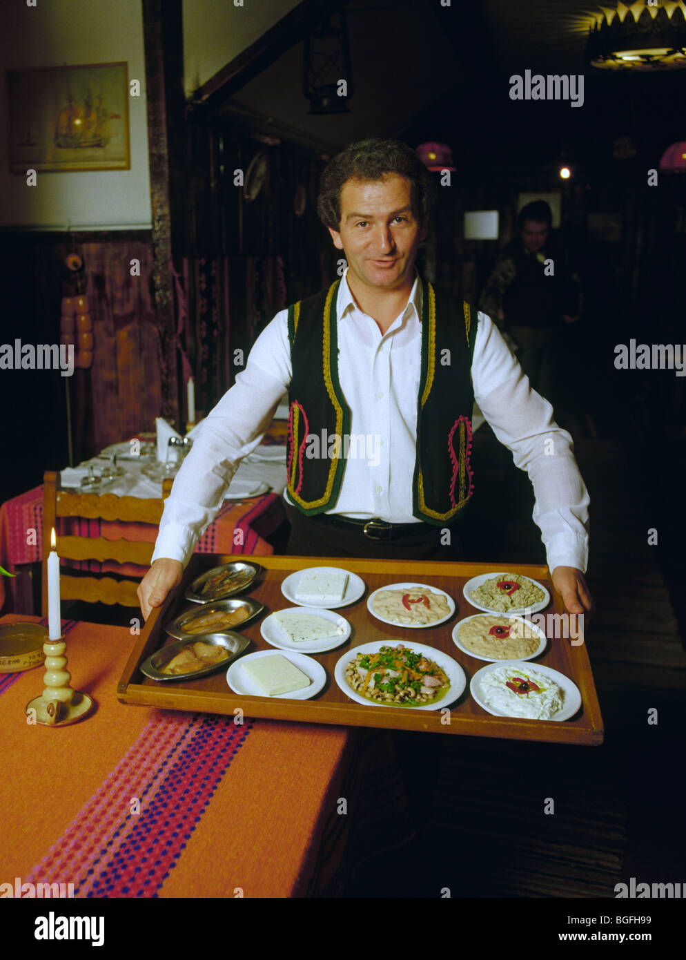 greece athens a waiter with a tray of mezedes Stock Photo - Alamy