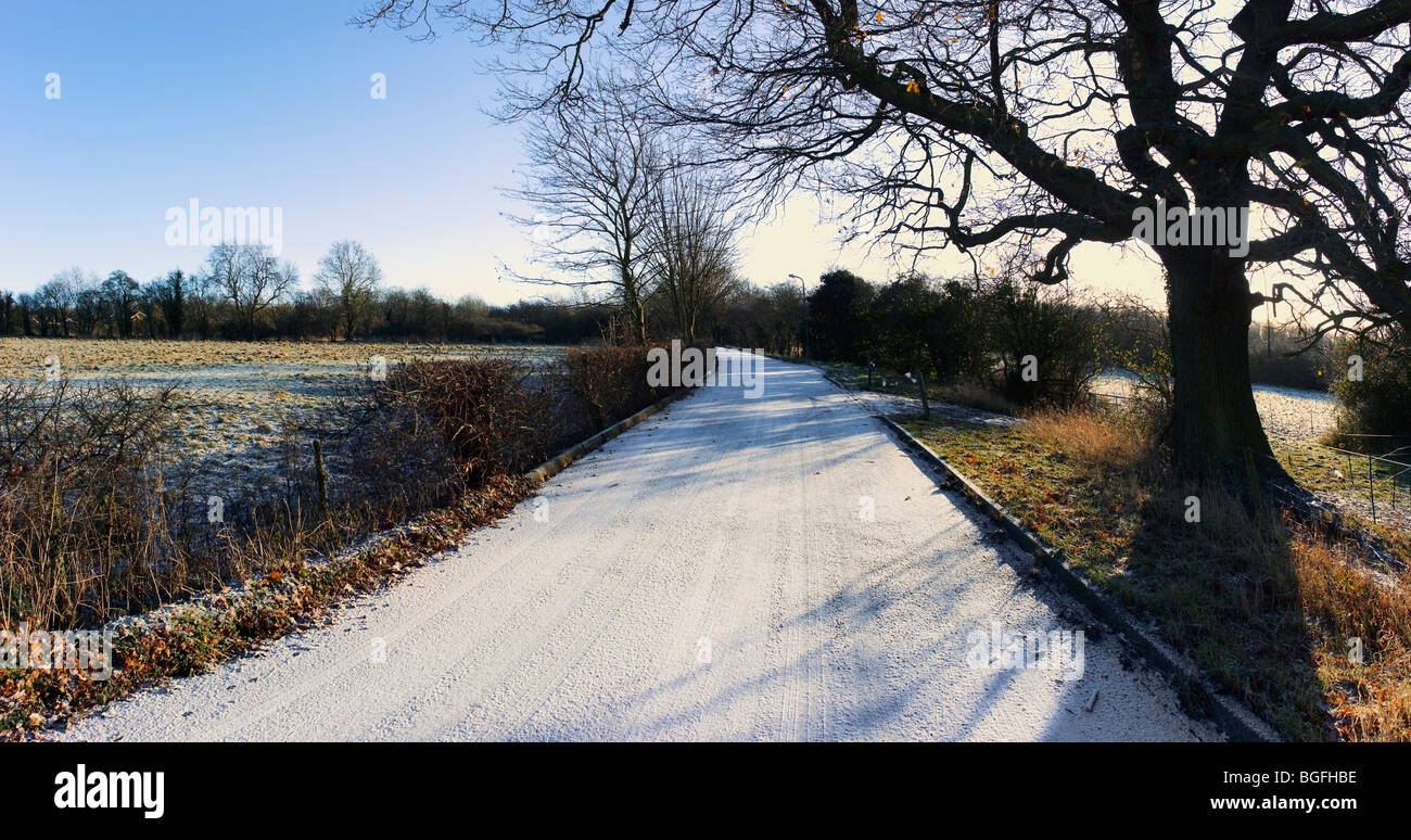a country lane covered with snow in a winter landscape Stock Photo - Alamy