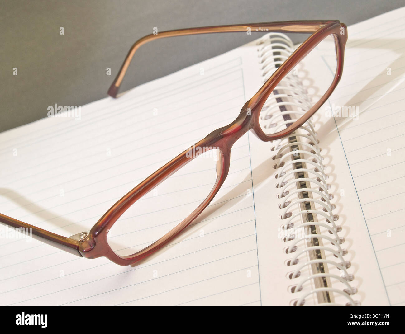 notebook and glasses Stock Photo - Alamy