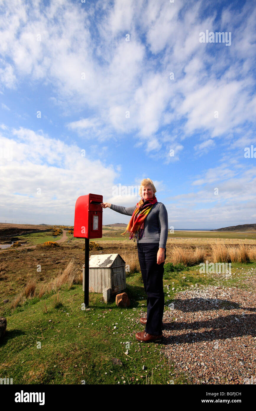 Woman posting letter in post hi-res stock photography and images - Alamy