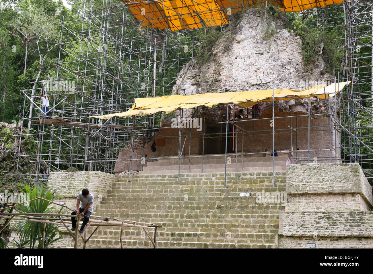 Workers restore a temple in the Plaza de los Siete Templos at Tikal, Guatemala Stock Photo - Alamy