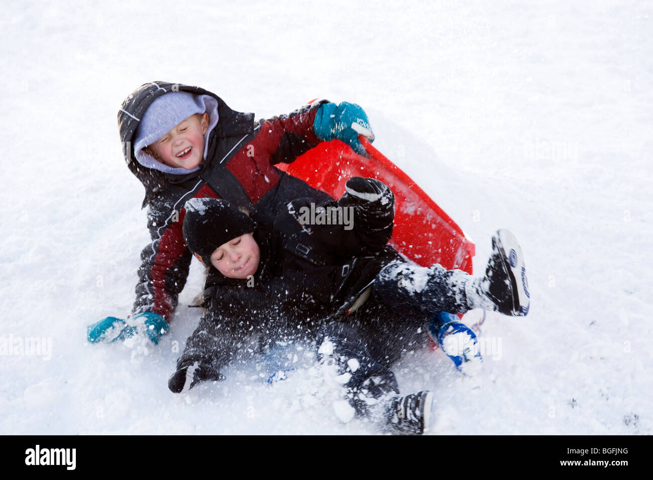 Boys sledging hi-res stock photography and images - Alamy