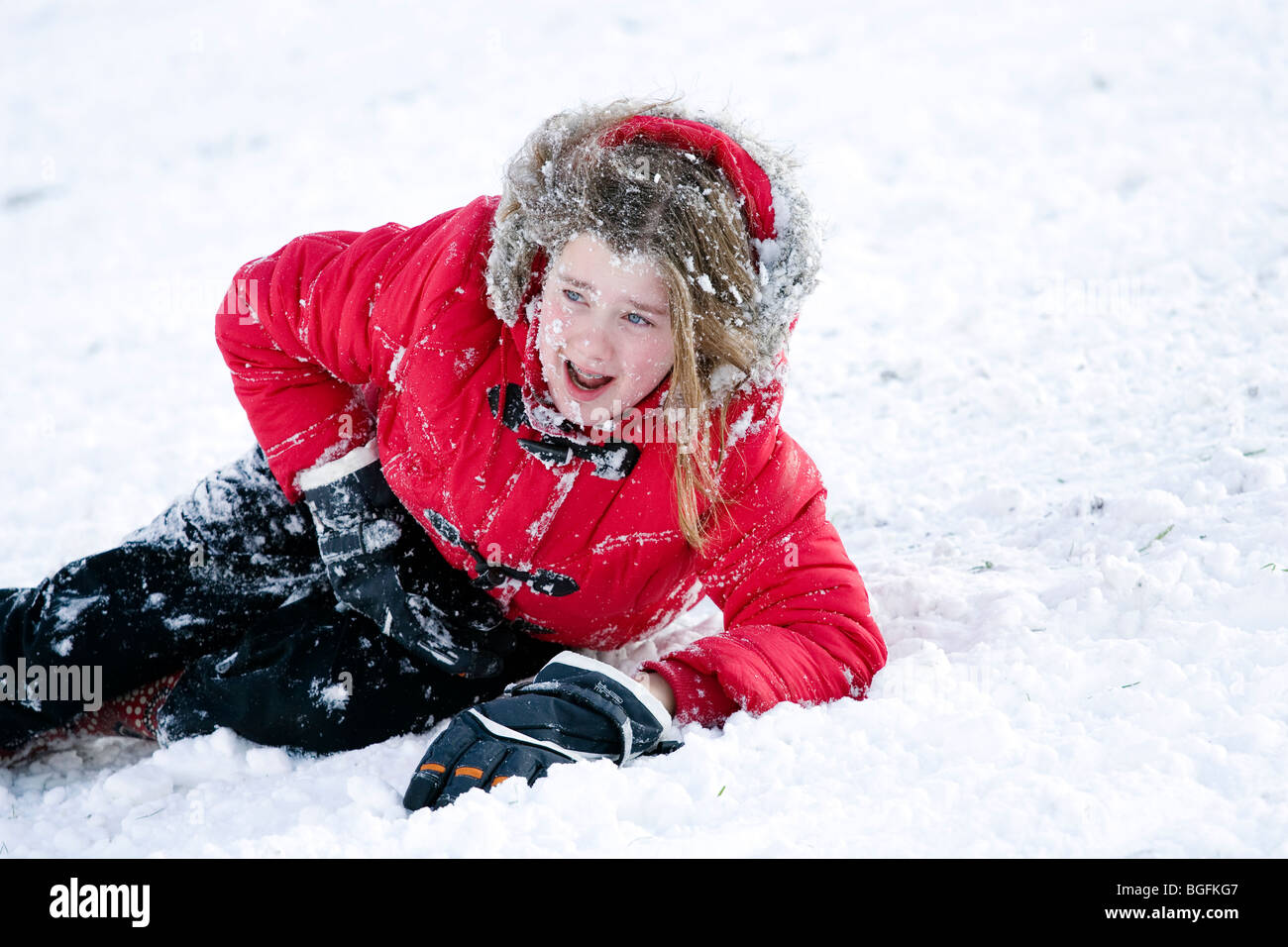 girl fallen in snow Stock Photo - Alamy