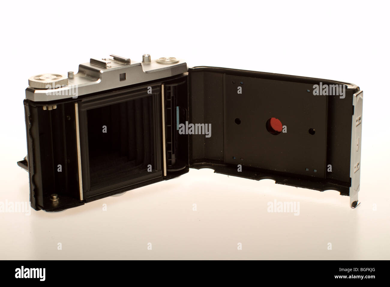 Retro camera with film back open Stock Photo - Alamy