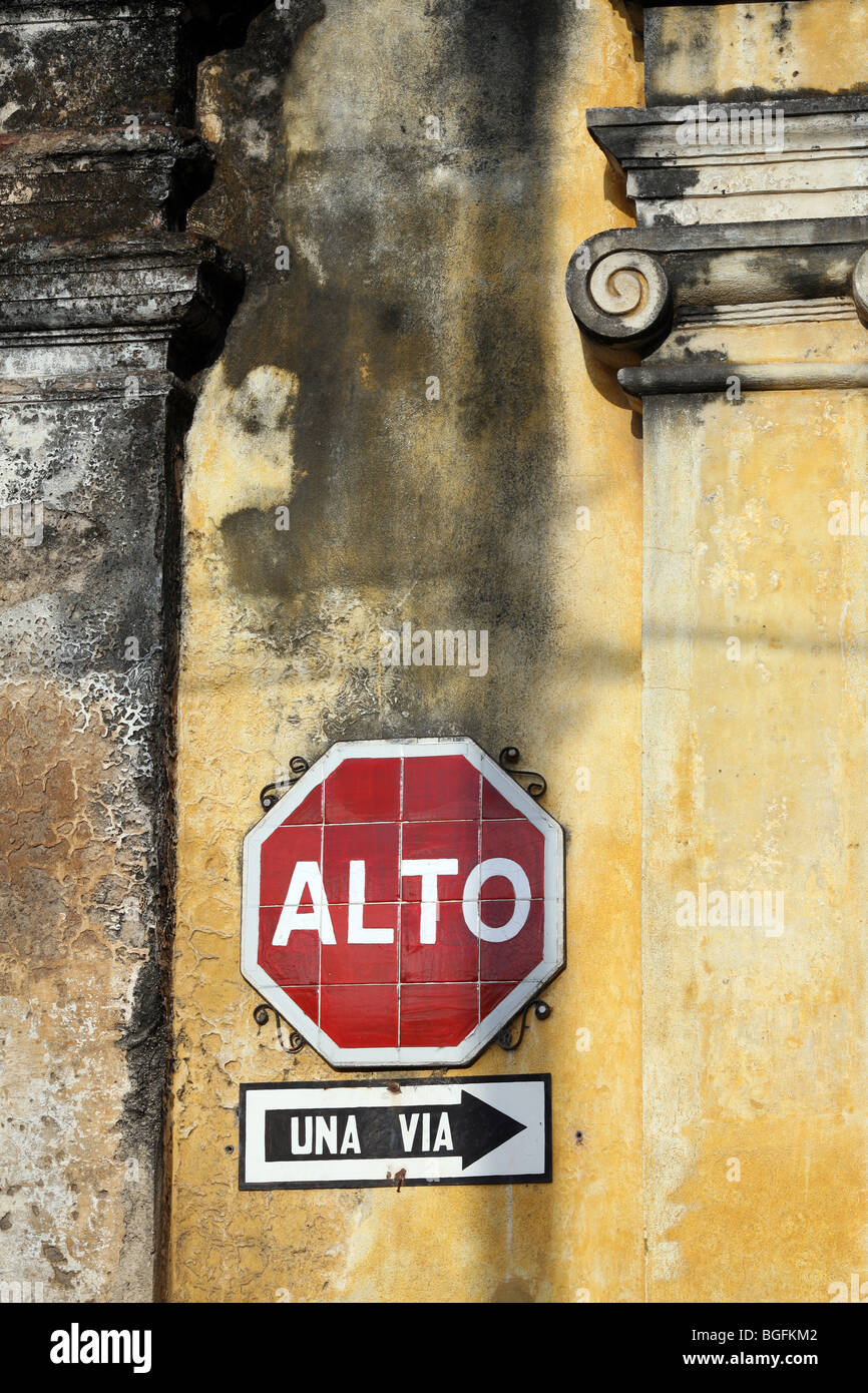 Stop (alto) sign and one way sign on Calle de los Pasos. Antigua ...