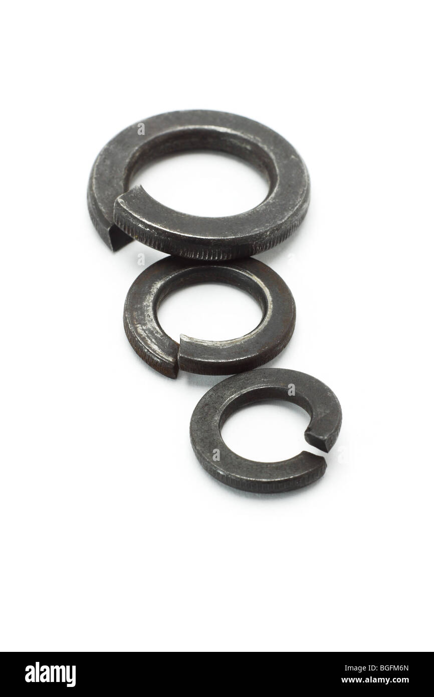 Three used metal washers on white background Stock Photo - Alamy